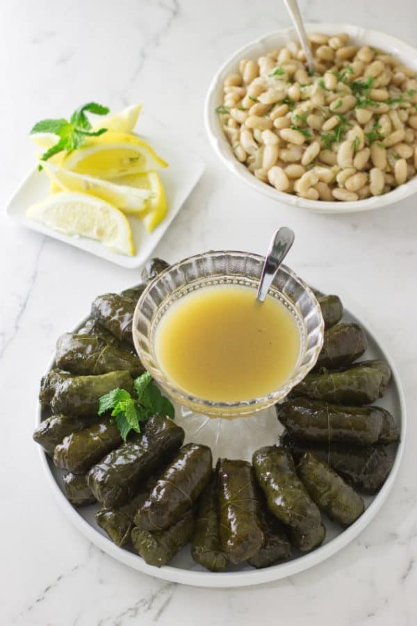 Meat Stuffed Grape Leaves with Cannellini Beans - Savor the Best